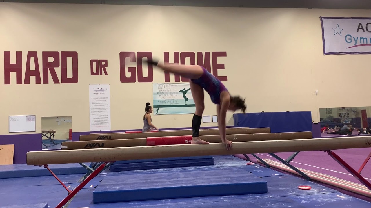 handstand half turn into full gainer dismount off beam - YouTube