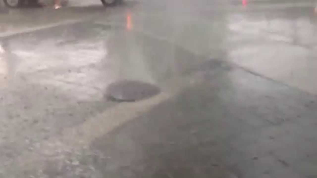 CRAZY Rain storm in Toronto makes manhole lids open - YouTube