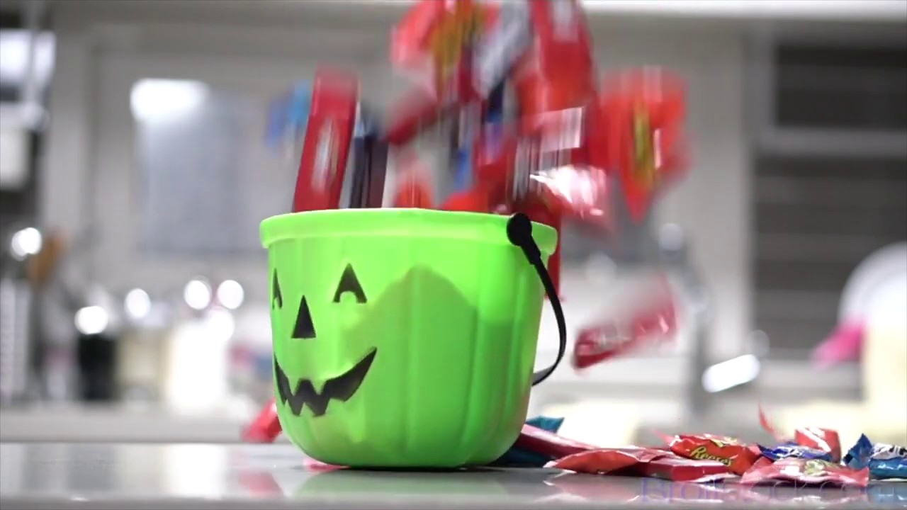 Candy Drops Into Halloween Trick Or Treat Bucket - Free Stock Footage ...