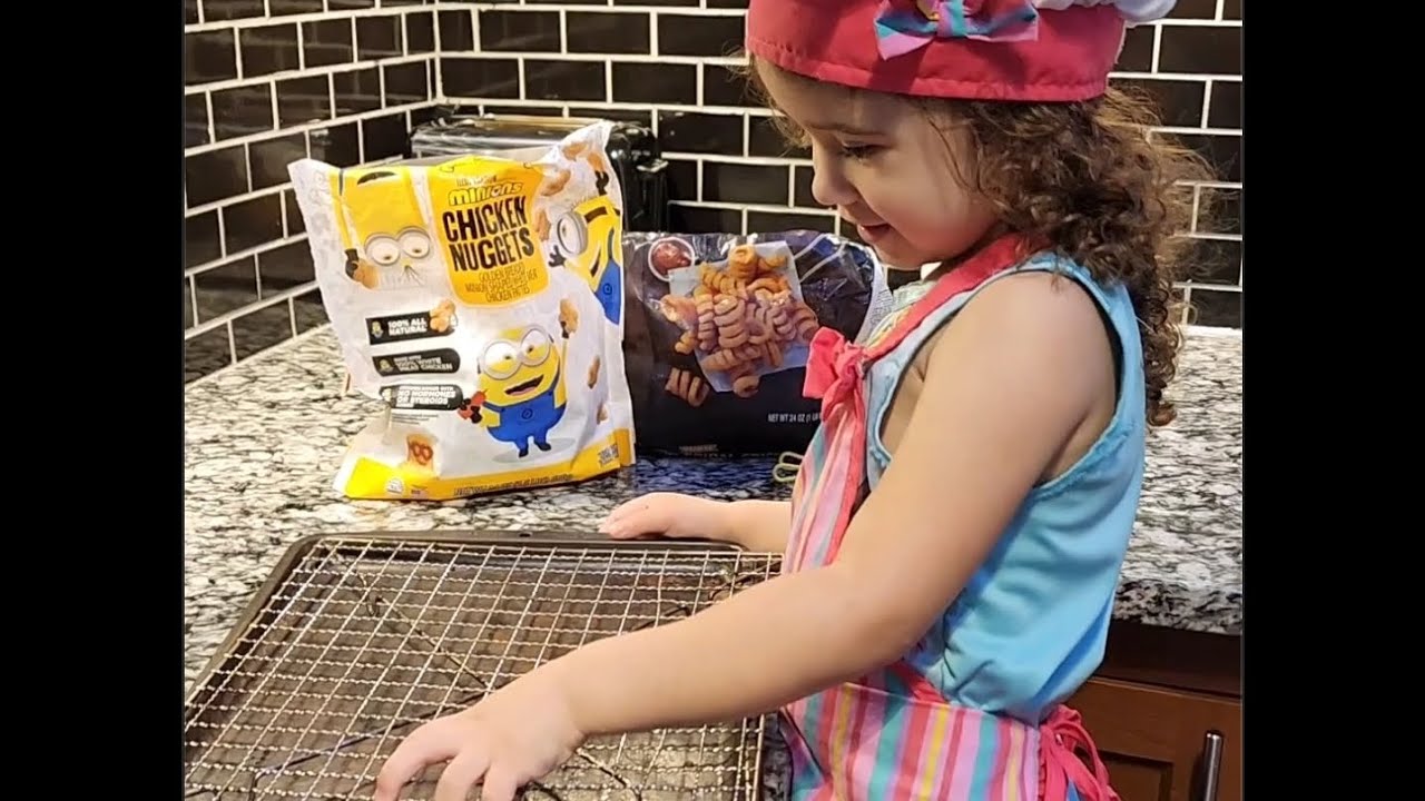 Ana and Ella try Minion chicken nuggets! They get thumbs up #minions # ...