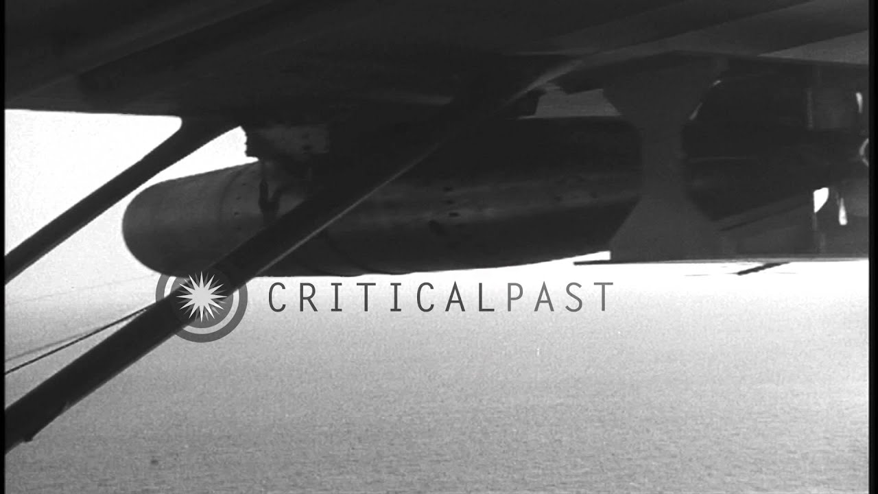 Torpedoes being dropped from PBY Catalina in flight over the sea in ...