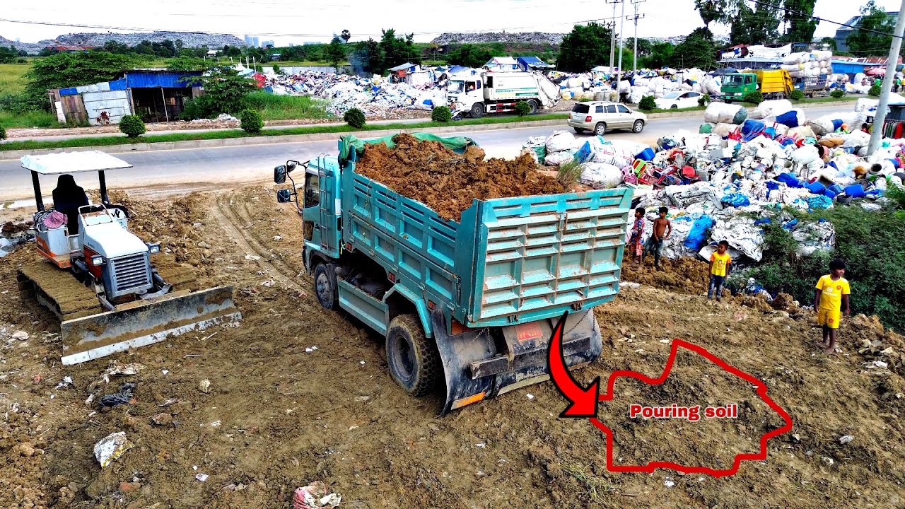 First Starting project dump trucks pouring soil Remove dirty flooded ...