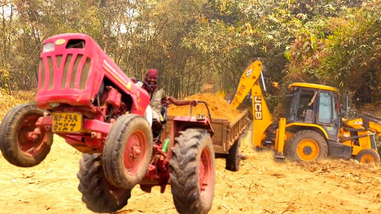 Jcb 3dx Backhoe Machine Loading Mud In Old Mahindra 265 Di Tractor ...