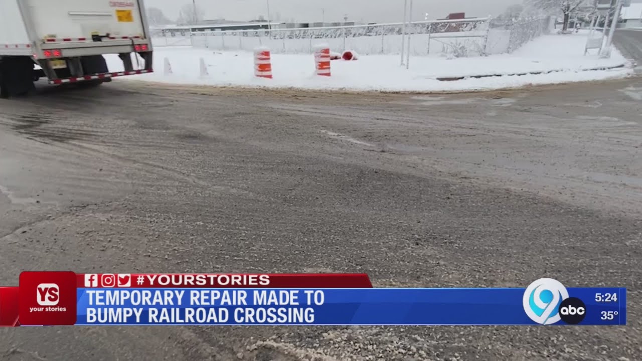 Temporary repair made to bumpy railroad crossing - YouTube