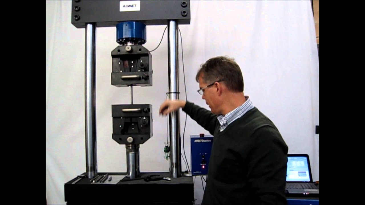 ADMET Hydraulic Testing Machine performing ASTM E8 Metals Tensile ...