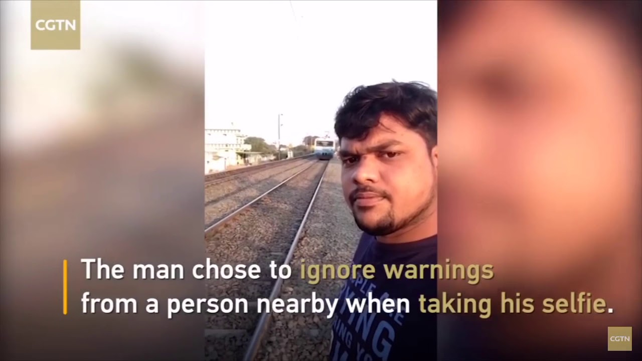 Shocking footage shows Indian man getting hit by a train while trying ...