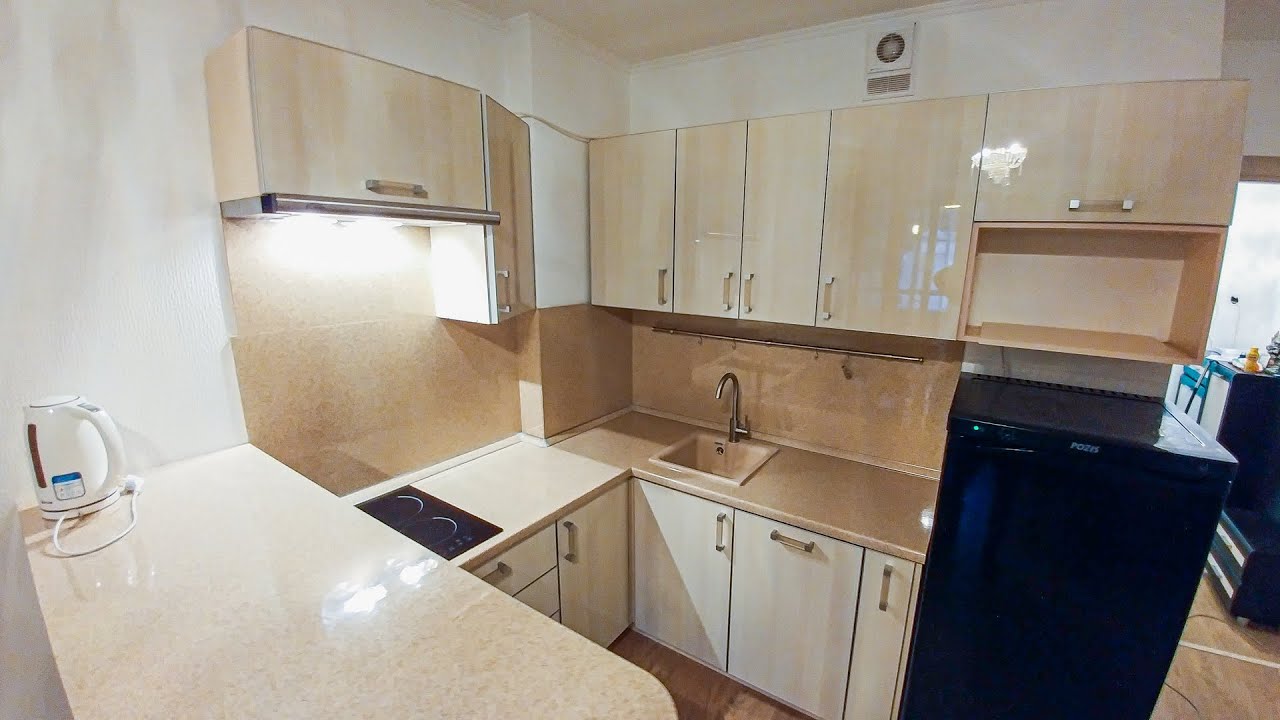 Custom project L-shaped kitchen with bar countertop in a studio ...