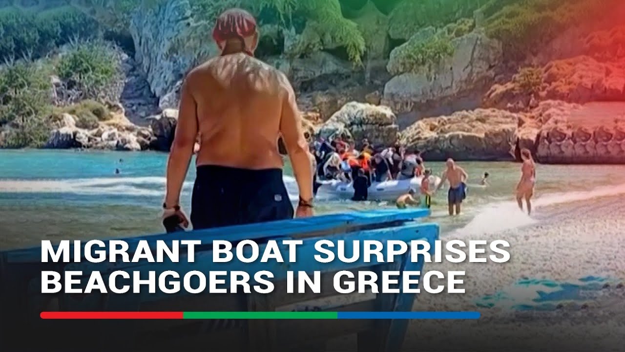 Migrant boat arriving in Greece surprises beachgoers | ABS-CBN News ...