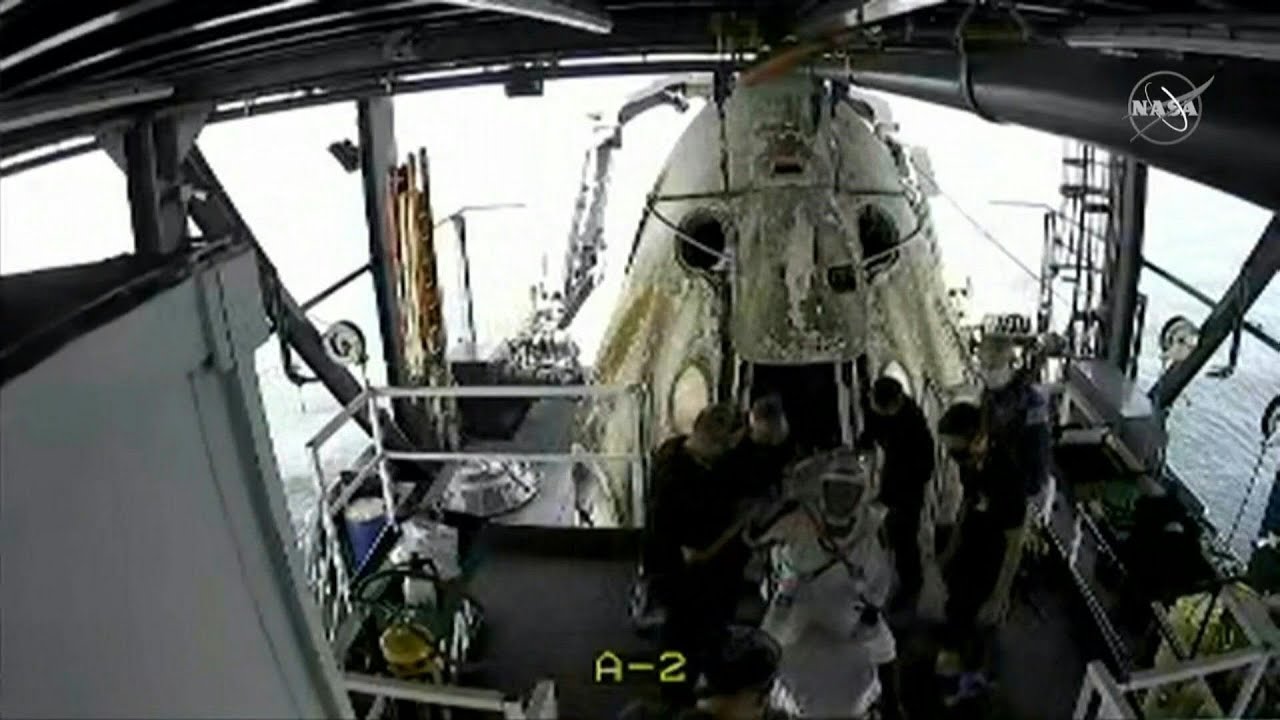 US astronauts exit space capsule after first splashdown in 45 years ...
