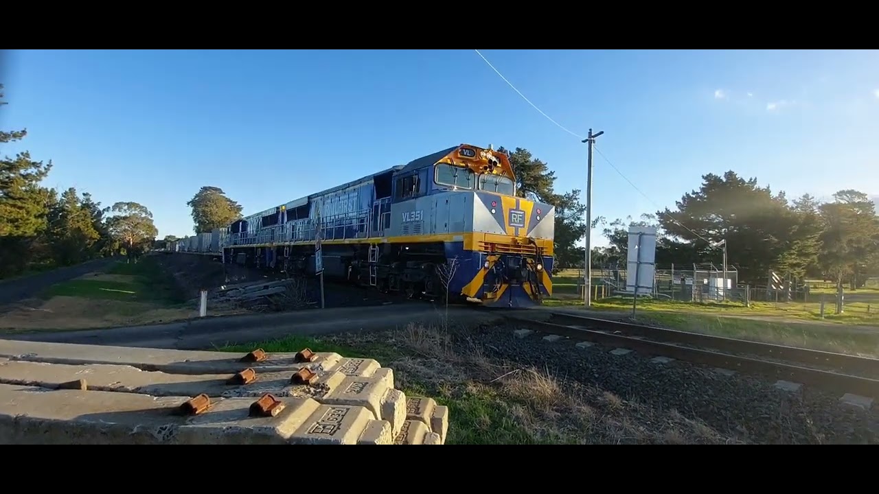 Australian train powers up & waiting for a bug to cross the tracks ...