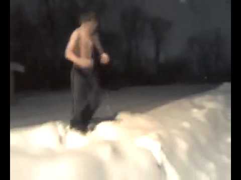 Kid jumps into snow pile with no shirt - YouTube