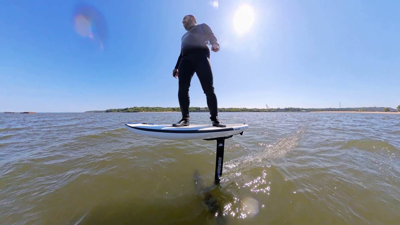 Riding a hoverboard over the water. - YouTube