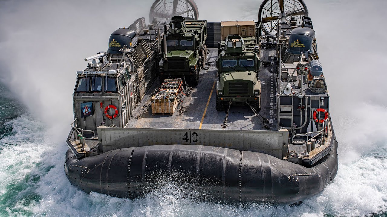 LCAC prepare to enter the well deck of the amphibious assault ship USS ...