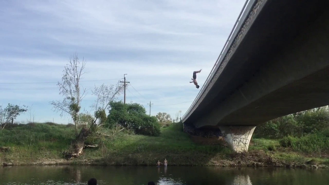Jumping off a bridge dirt bike racing - YouTube