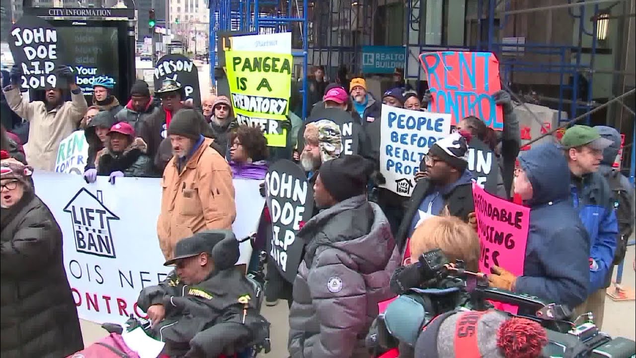 Protesters march downtown on issue of rent control - YouTube