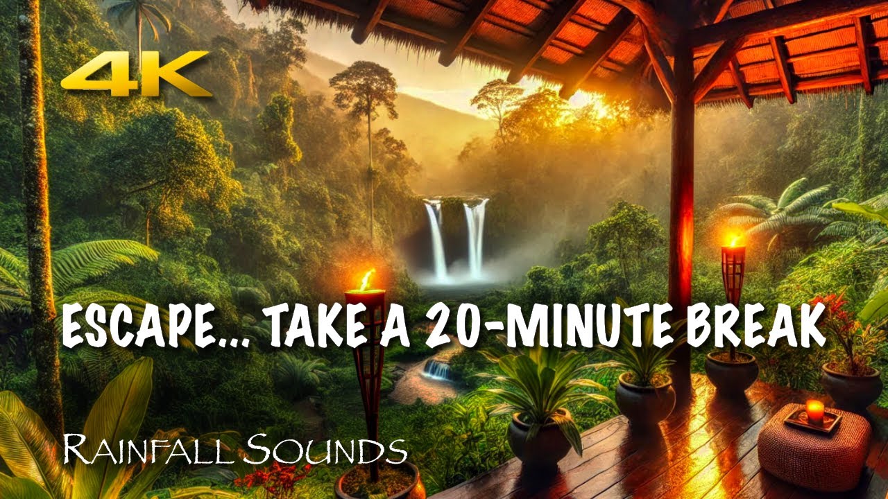 Rain falling on bamboo home deck tiki torches flickering waterfall pool ...