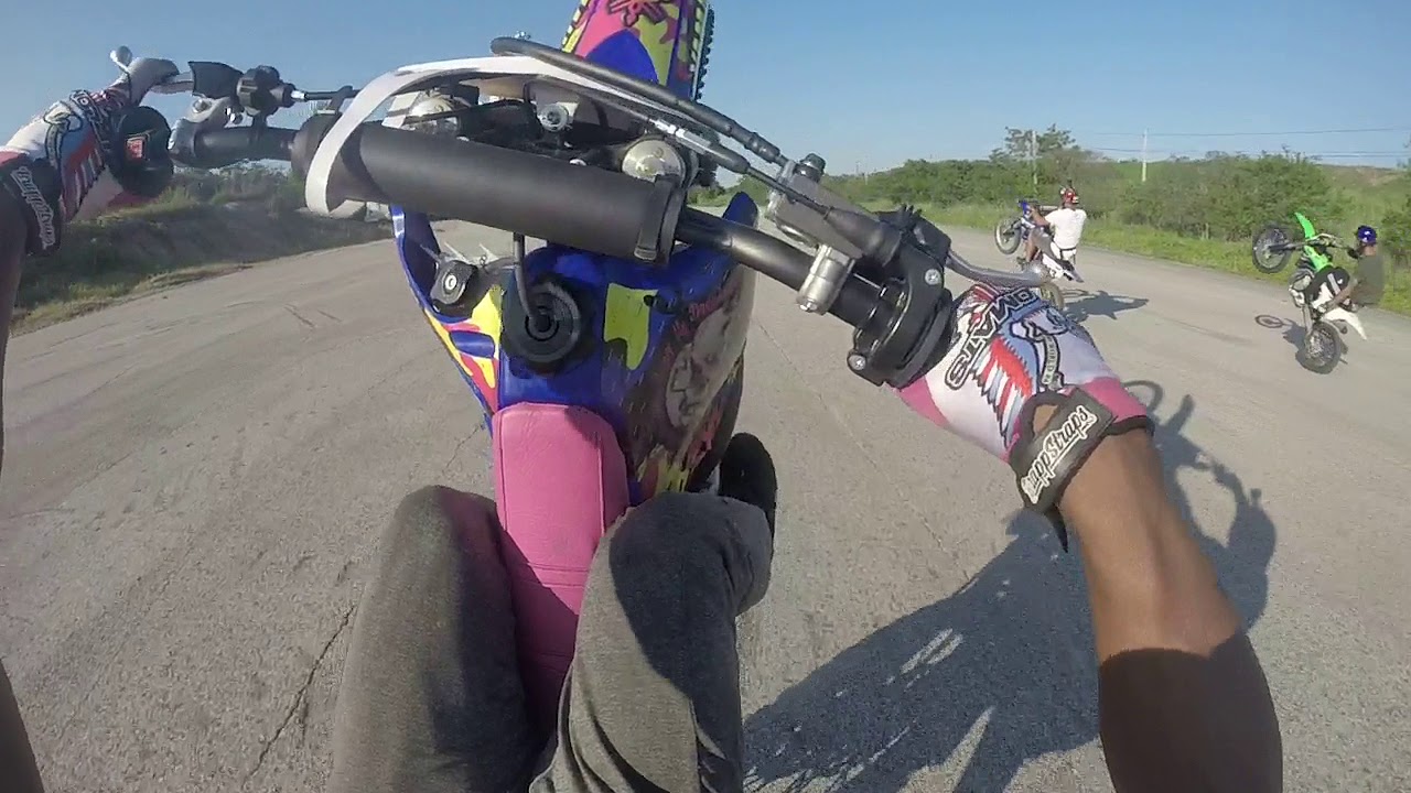 How to wheelie A Dirt Bike/Oneway corey on a Banshee - YouTube