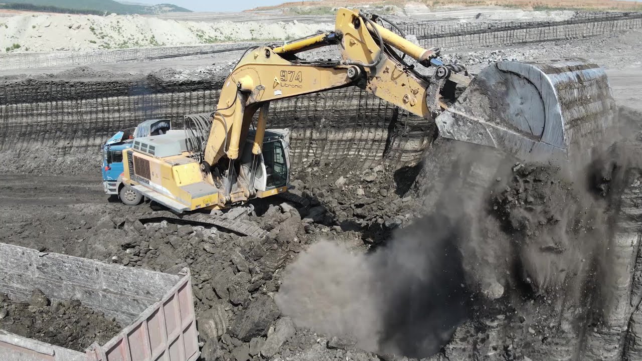 Caterpillar & Liebherr Excavators Loading Trucks On Huge Mining Area ...