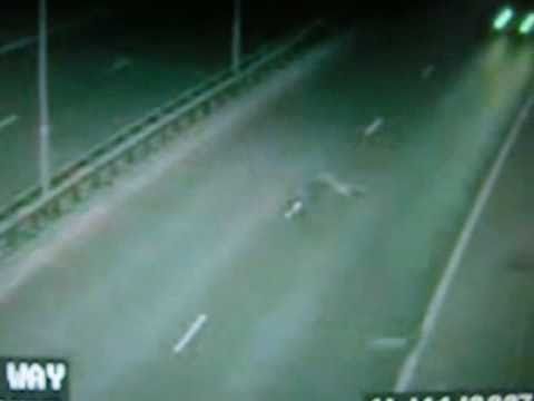 Alien Runs Across Highway CCTV - YouTube
