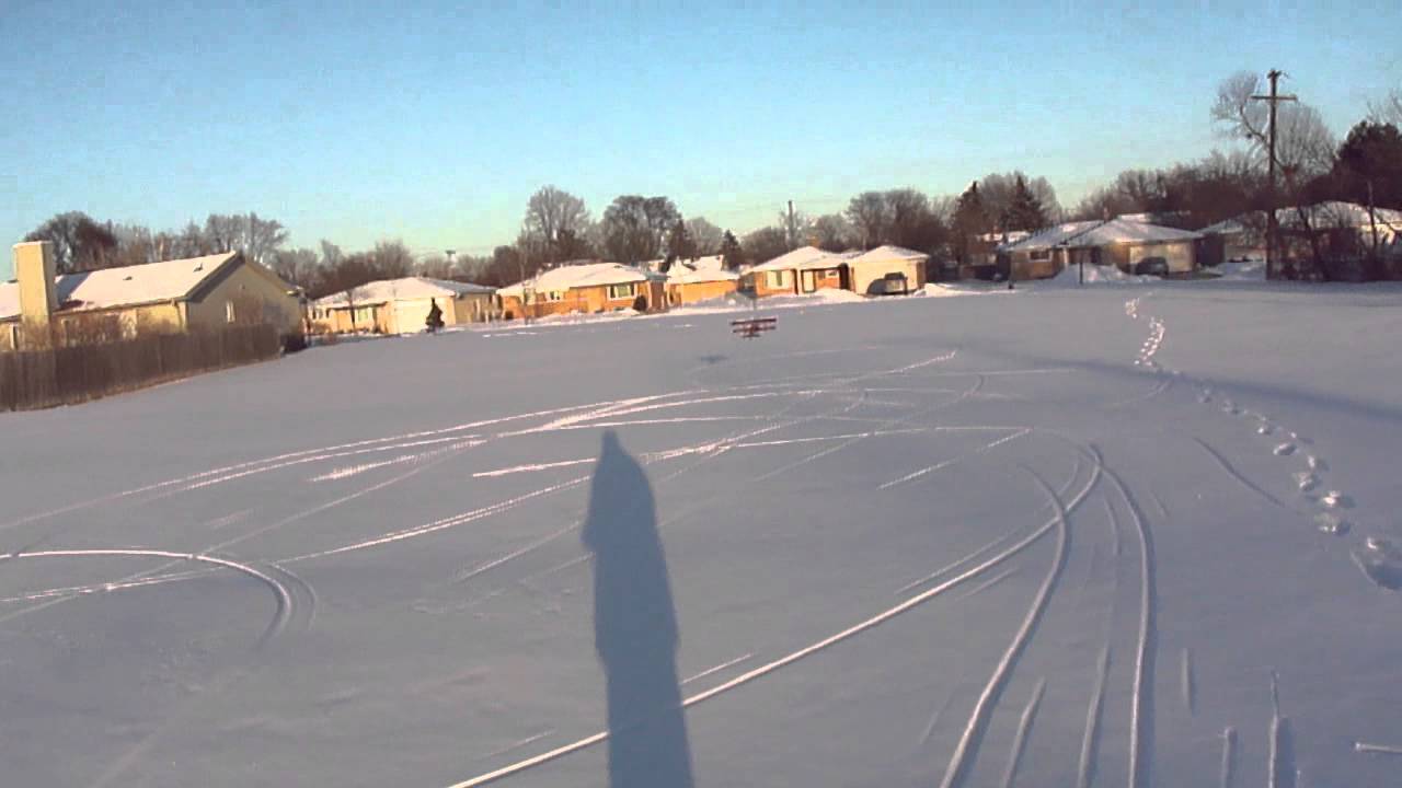 Biplane with snow ski's flight video. Plans go to http ...