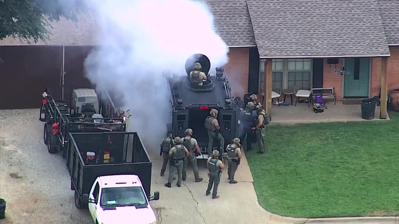 WATCH: Tactical team deploys tear gas during barricade situation in ...