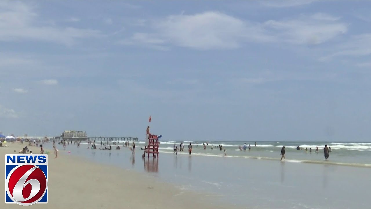 Lifeguards rescue dozens as rip currents plague crowded beaches - YouTube