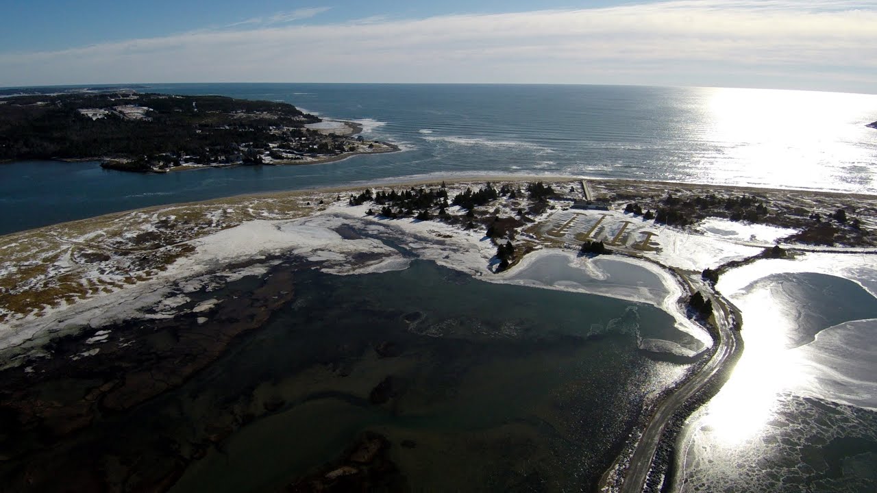 Aerial video over thin ice near Rainbow Haven Beach - YouTube