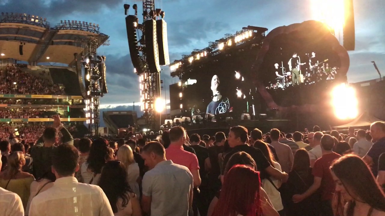 Beer bottle strikes Coldplay guitarist in the head. Chris Martin almost ...