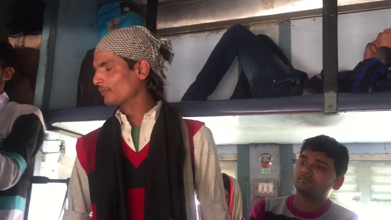 Amazing Indian street singer in train hum tere saher me aaye hai ...