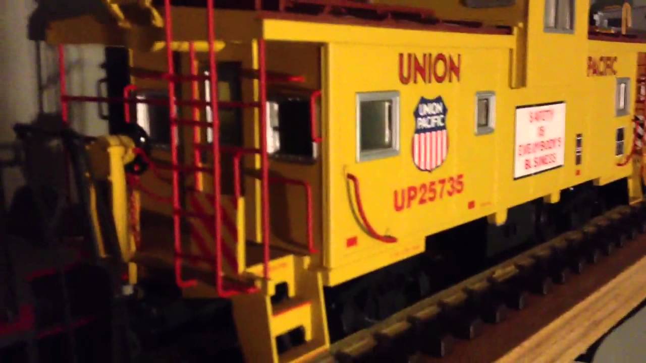 G-scale locomotive and caboose look at. - YouTube