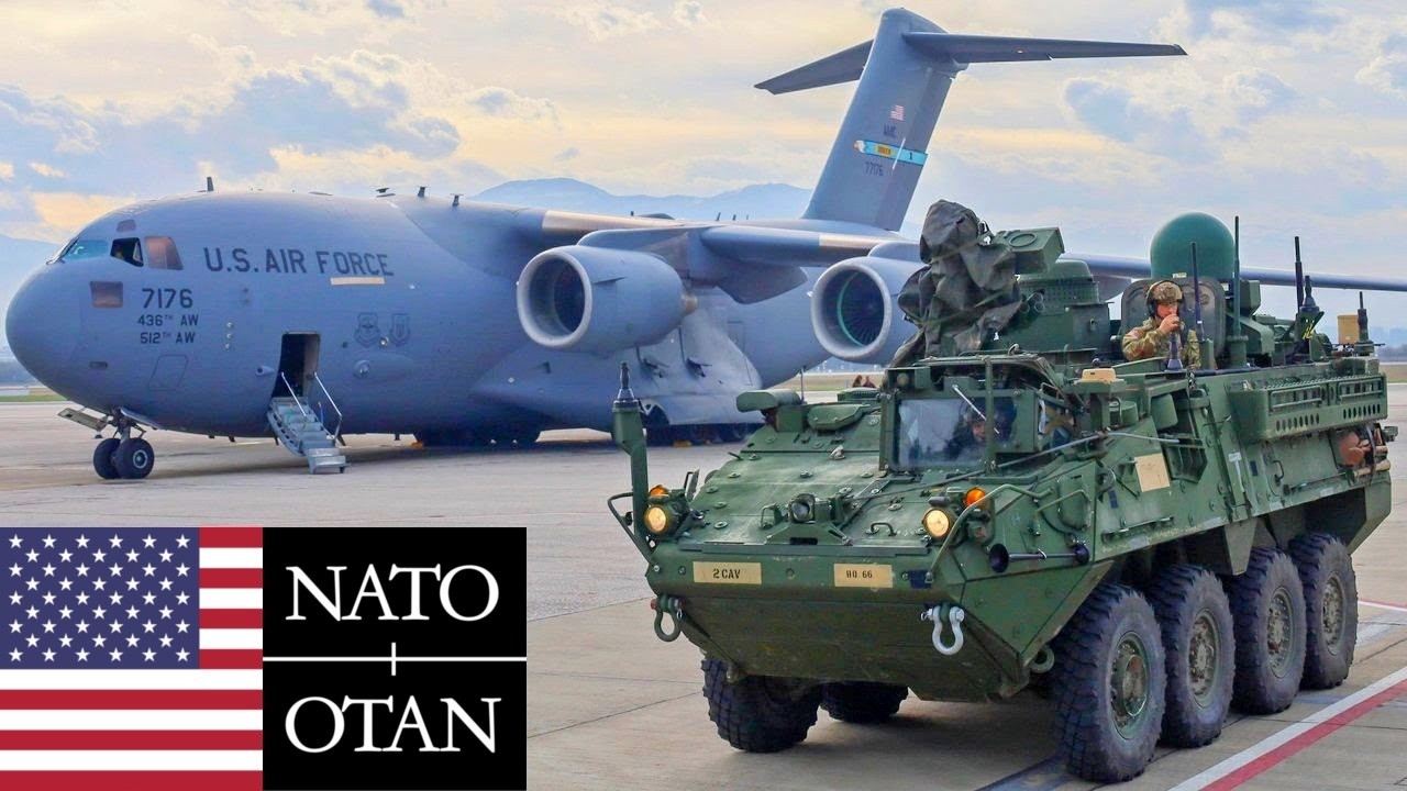 US Army, NATO. Soldiers and armored vehicles during military training ...