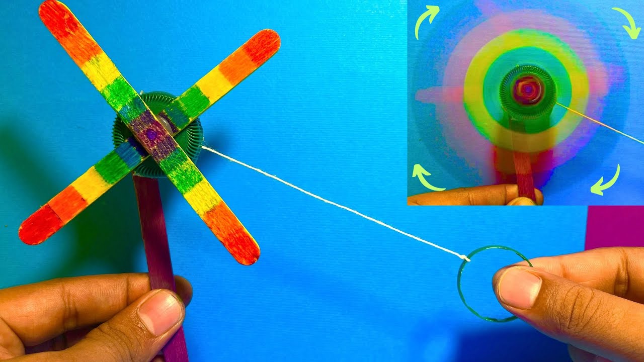 A Rainbow Spinning toy which you can easily make with ice cream sticks ...