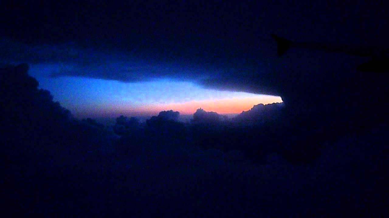 lightning from plane window italy - YouTube
