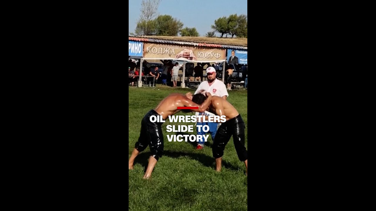 Watch: Oil wrestlers slide to victory - YouTube