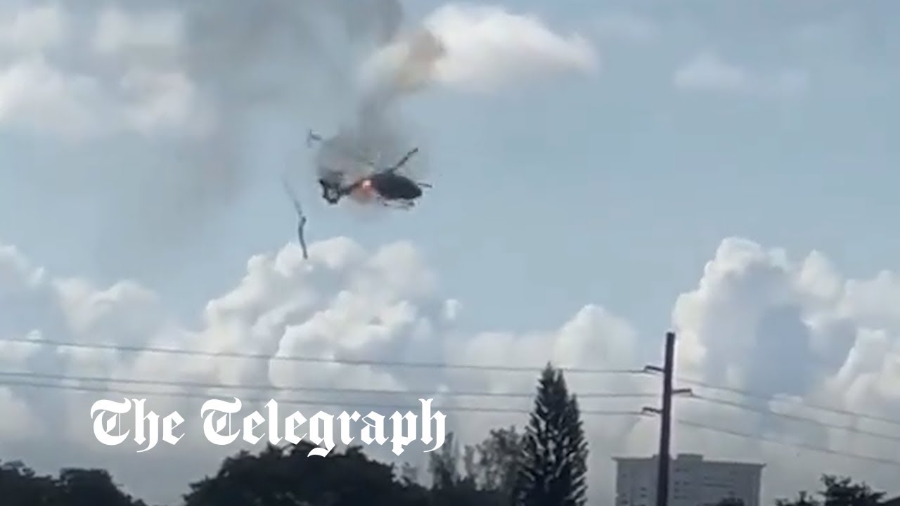 Burning helicopter crashes in Florida leaving two injured - YouTube