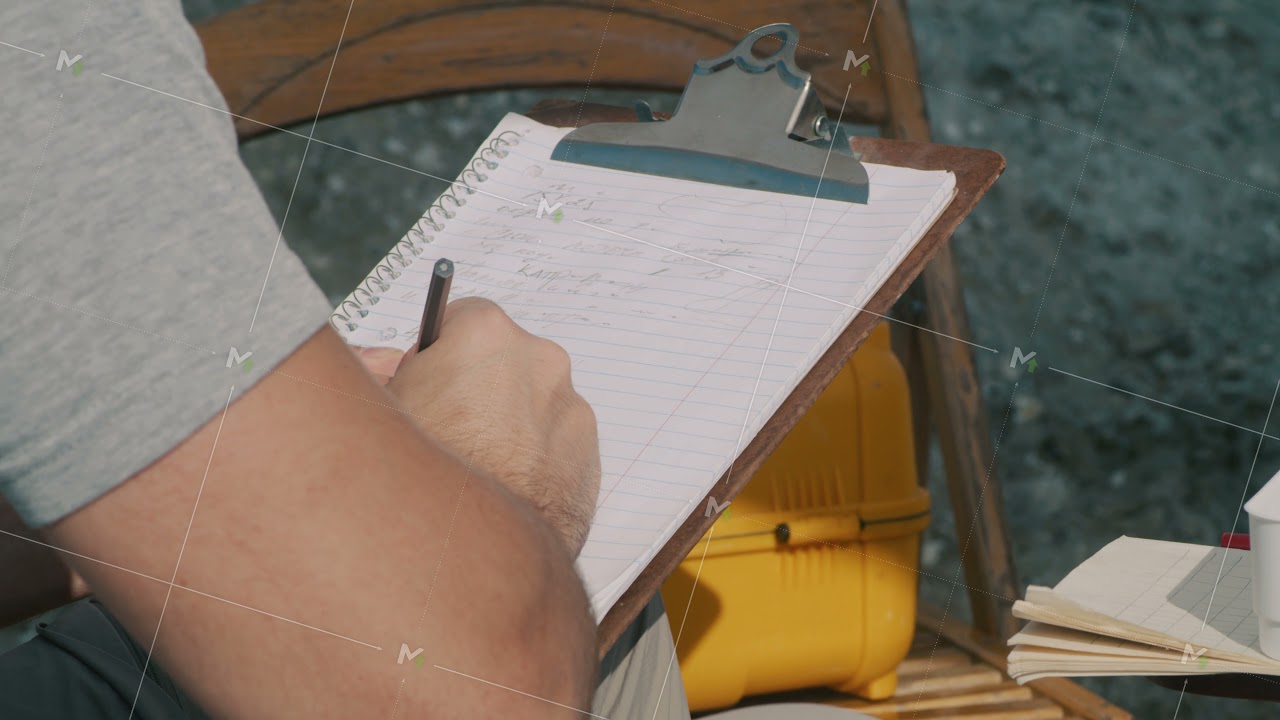 Crop archaeologist making notes on clipboard - YouTube