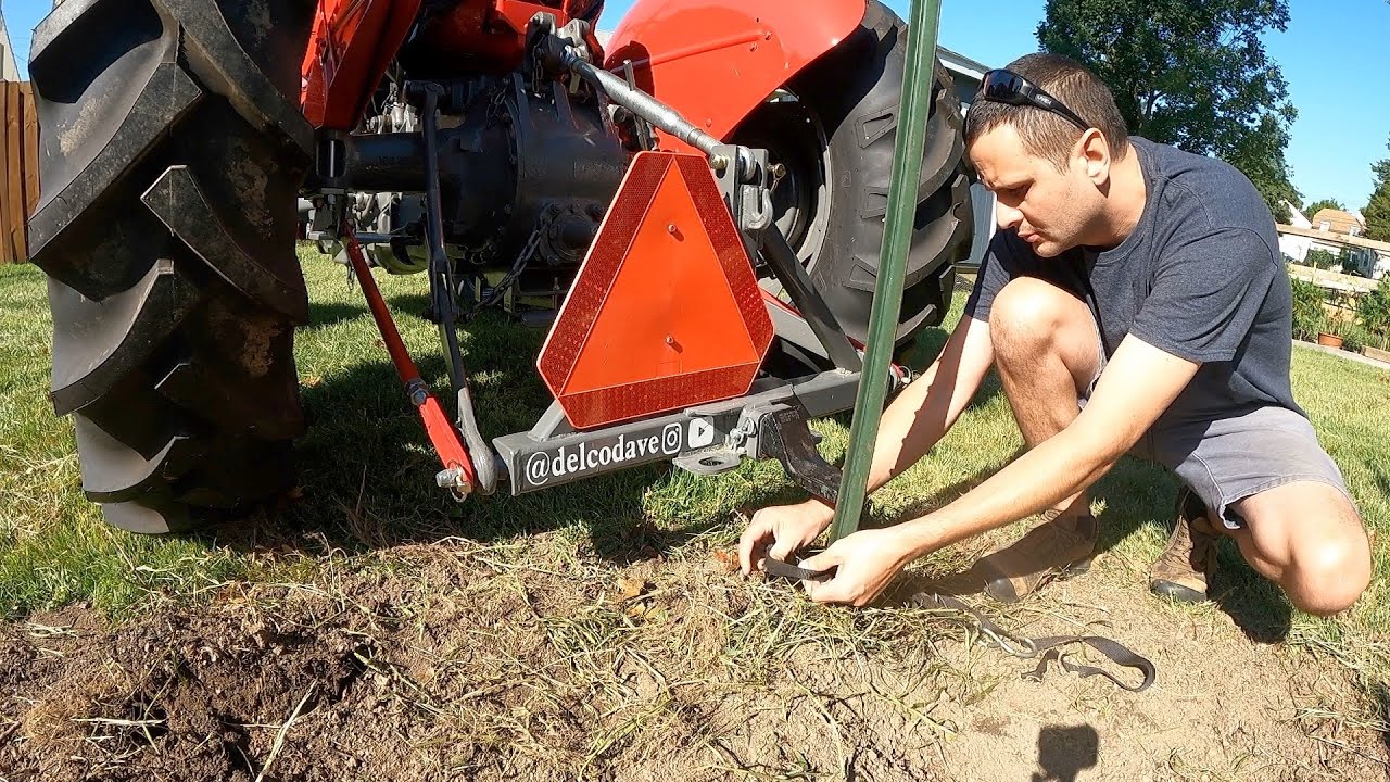 Pulling T-Posts with a Tractor #masseyferguson - YouTube
