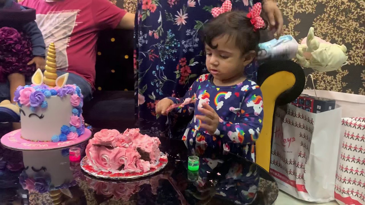 Amyrah messing with cake - YouTube