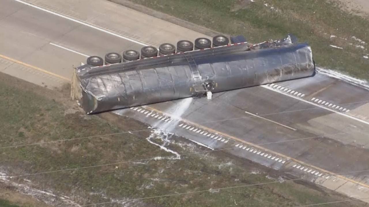 Tanker overturns, spills milk on highway - YouTube