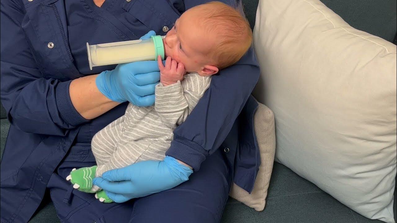 Suck training while bottle feeding - YouTube