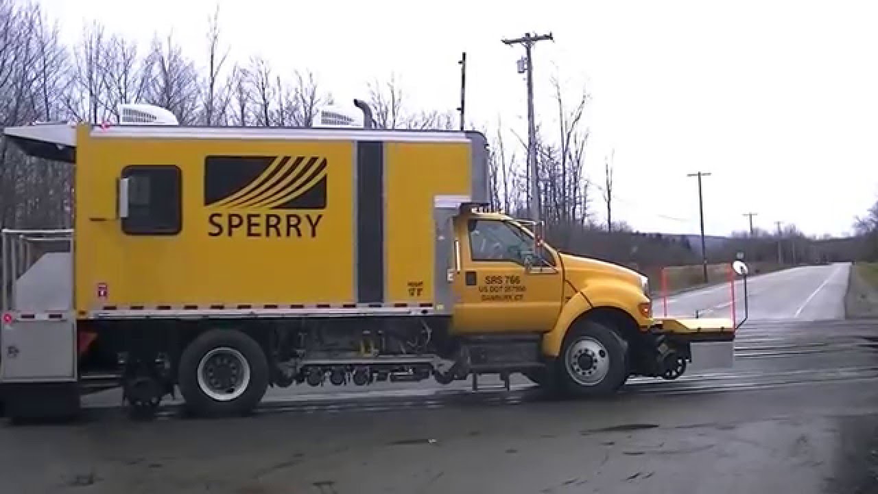 Sperry Rail Service Ford Hi-Rail switching to Track - YouTube