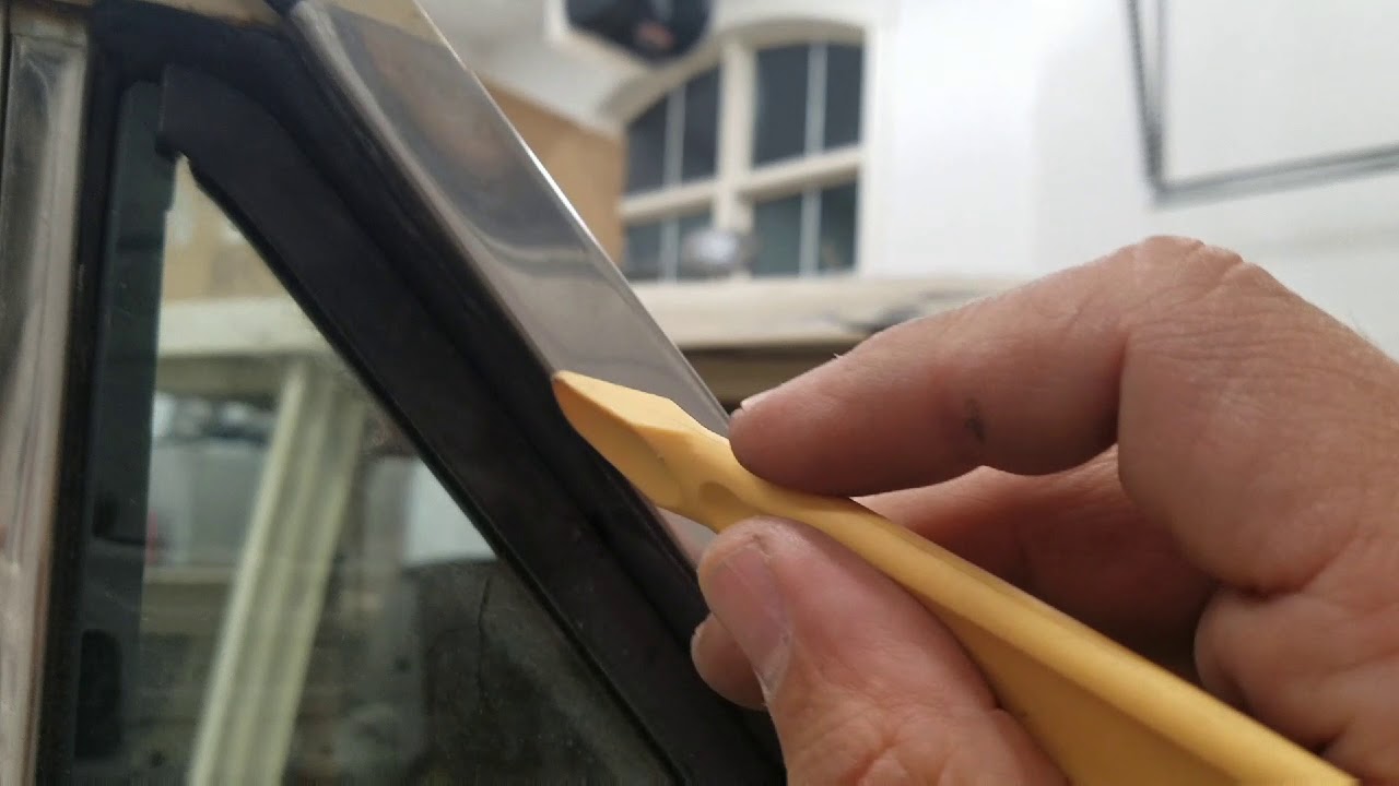 Removing exterior stainless door window trim - YouTube