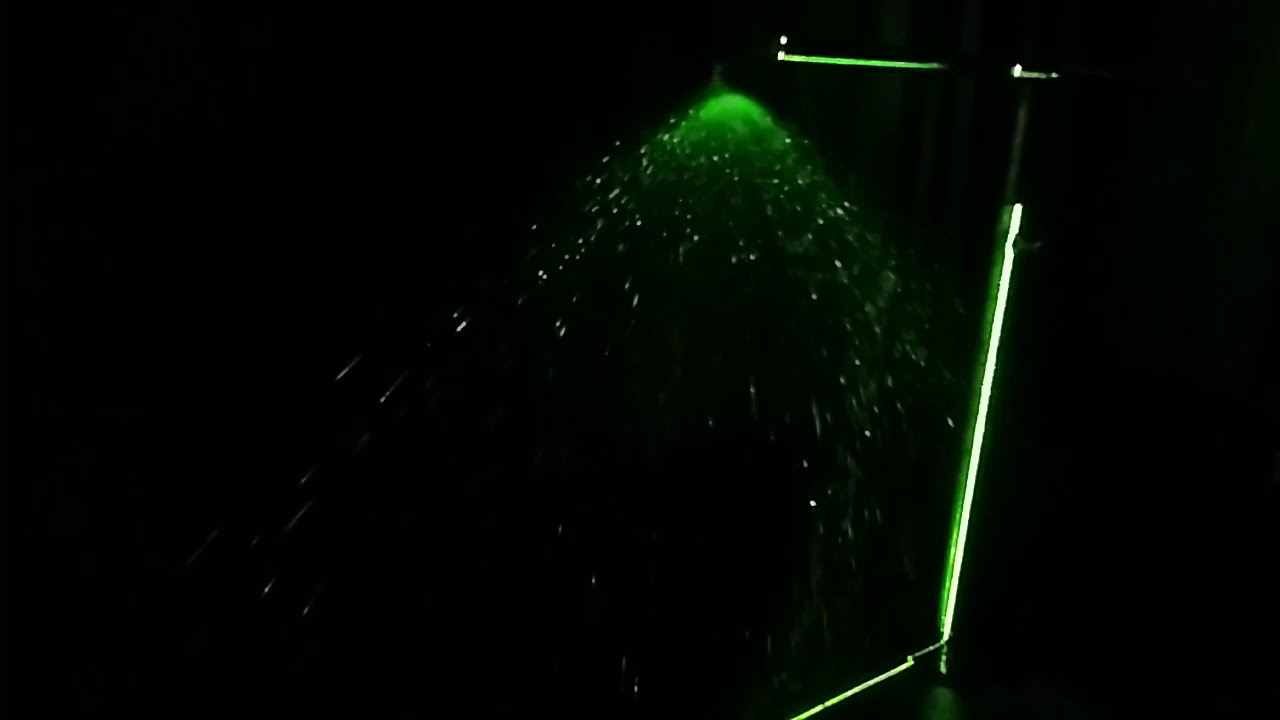 Line laser and water spray in dark - YouTube