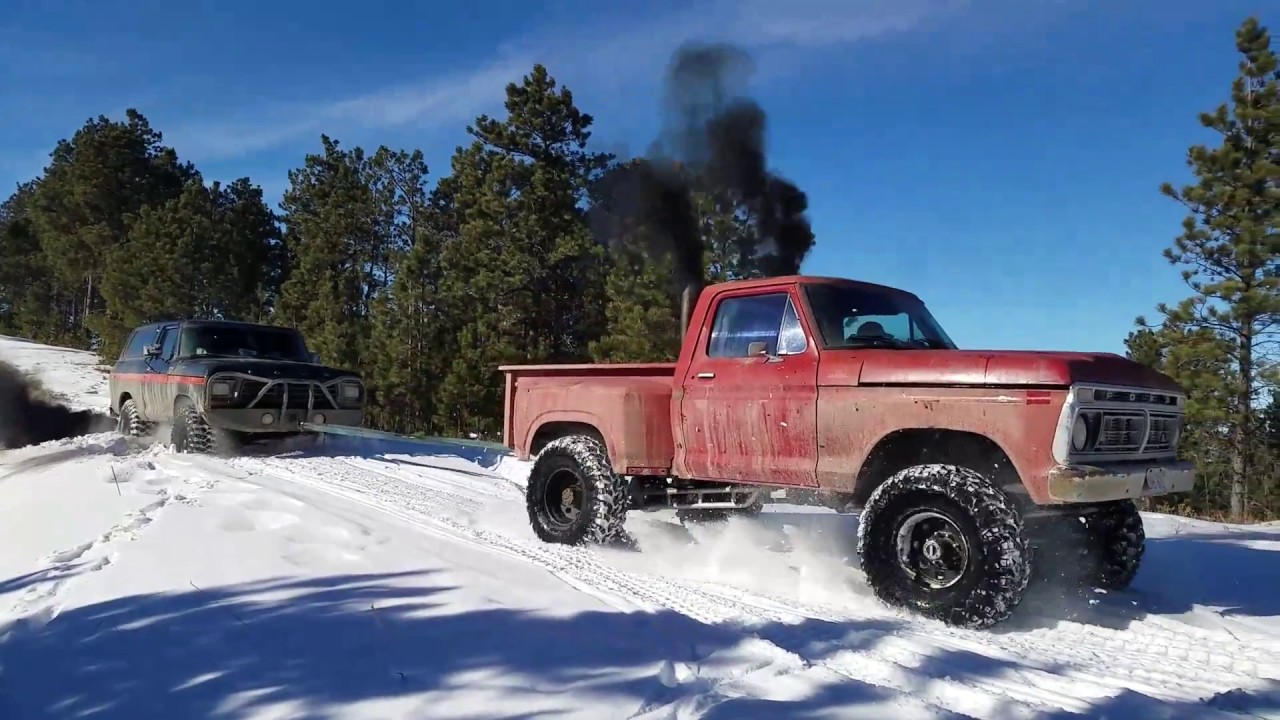 500 hp Cummins Ford pulling my Cummins Bronco out of the snow. - YouTube