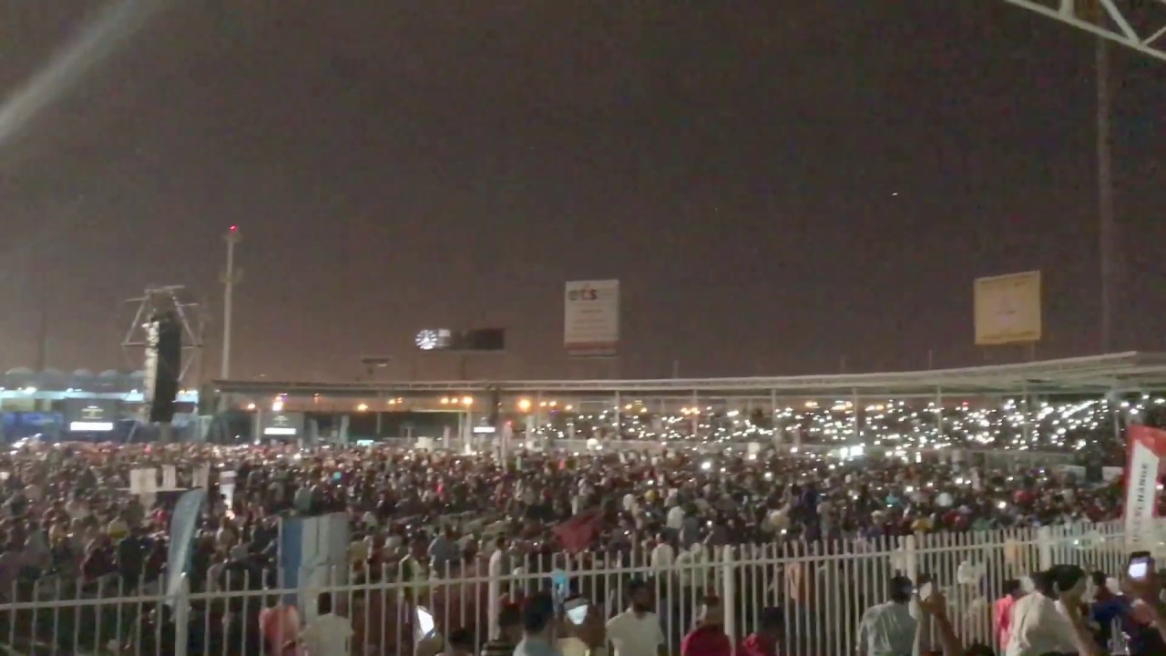 The concert crowd raise their mobile phones with lights - YouTube