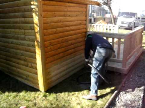 applying textrol wood oil to garden shed - YouTube