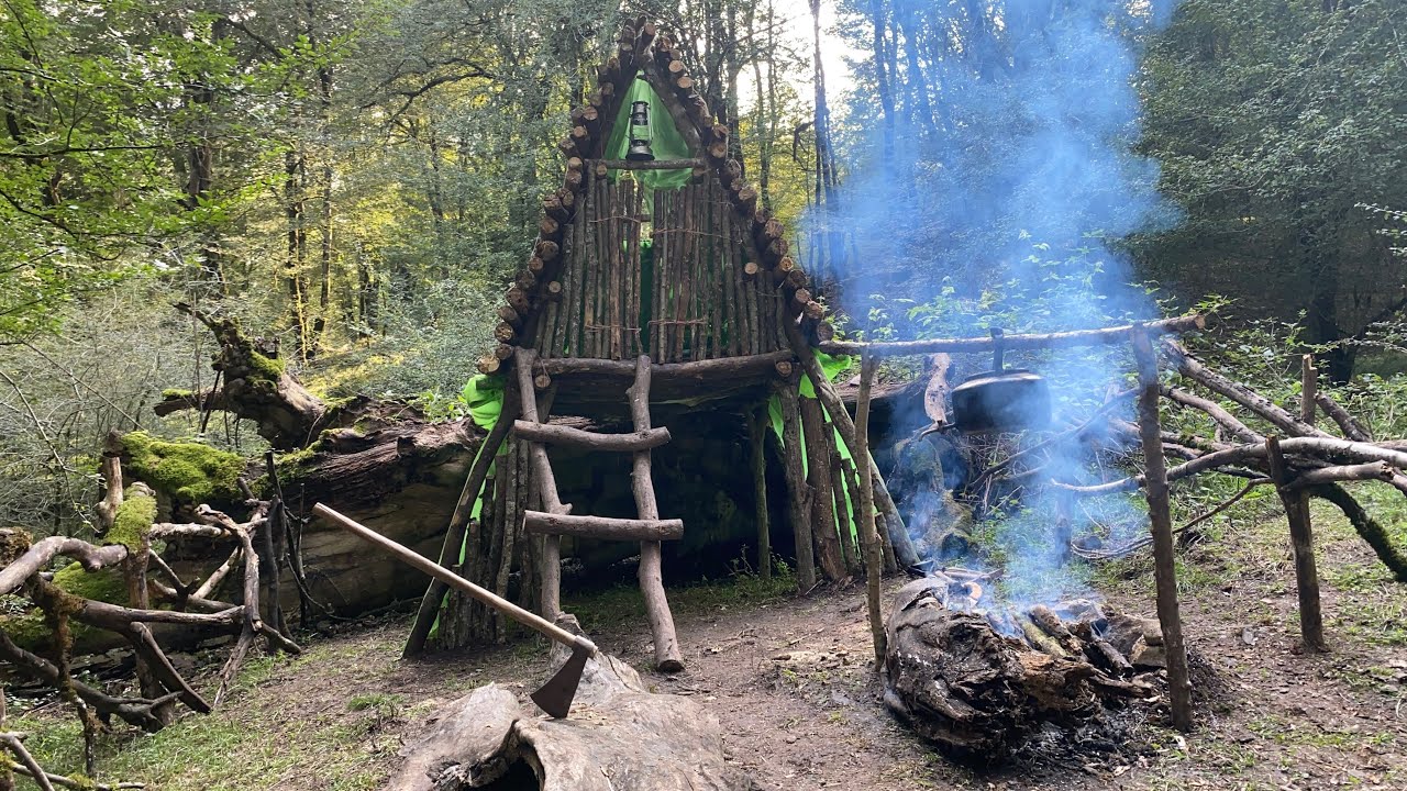 Building Complete And Warm Bushcraft Survival Shelter On A Fallen Trunk ...