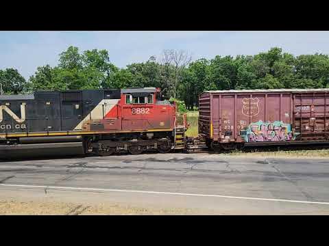 CN 2269, 2523, 8882 moving a Westbound train with BN, BNSF covered hoppers near Vicksburg, MI ...