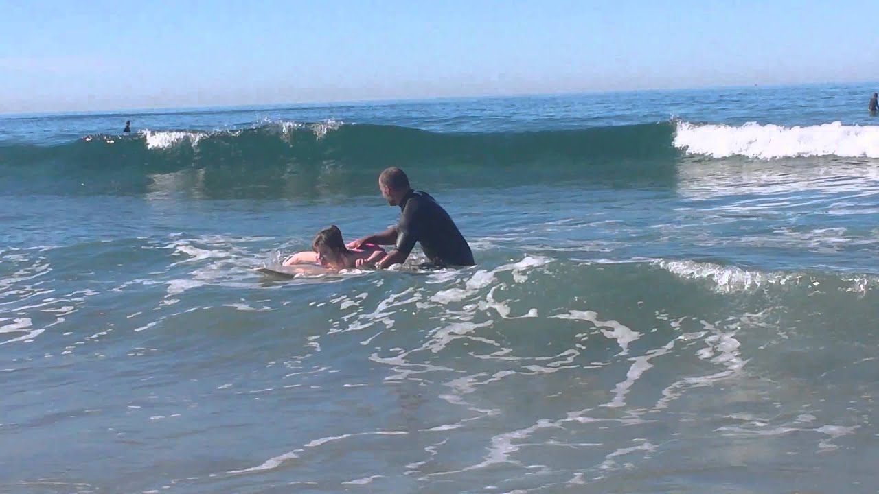 Taylor surfing at the beach - YouTube