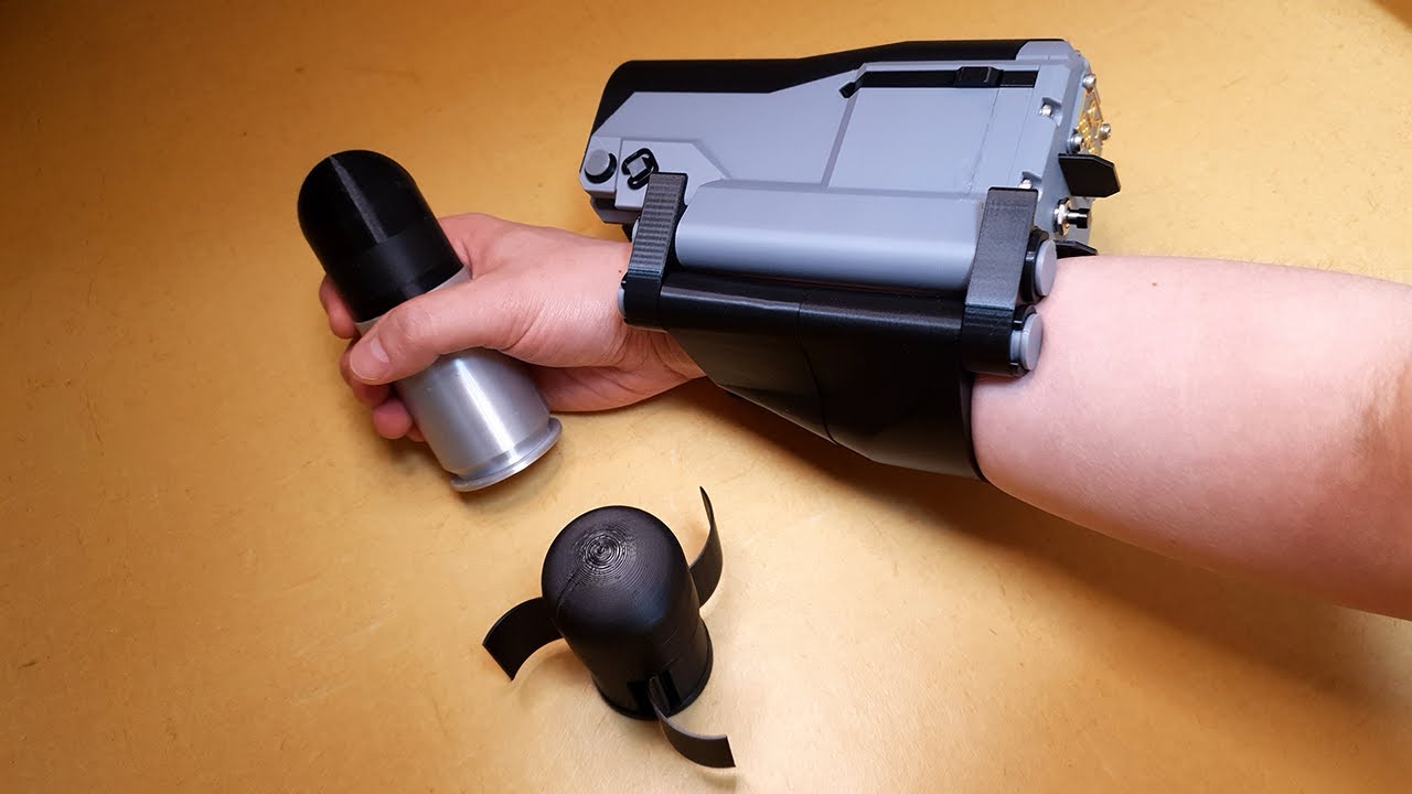 Fin deployable Projectile with Wrist mounted 40mm Grenade launcher ...